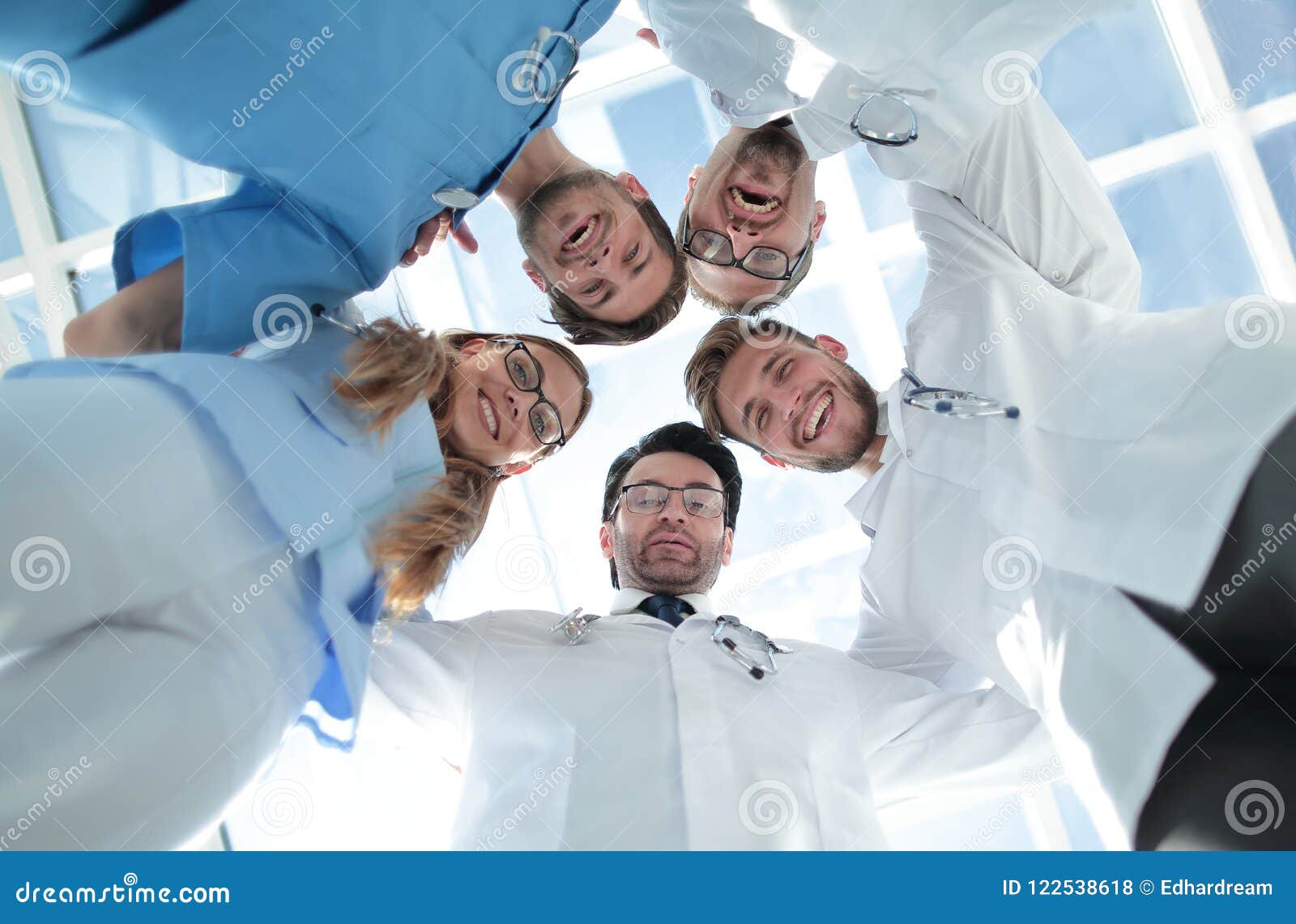 Doctors Looking Down Smiling at the Camera Stock Photo - Image of ...
