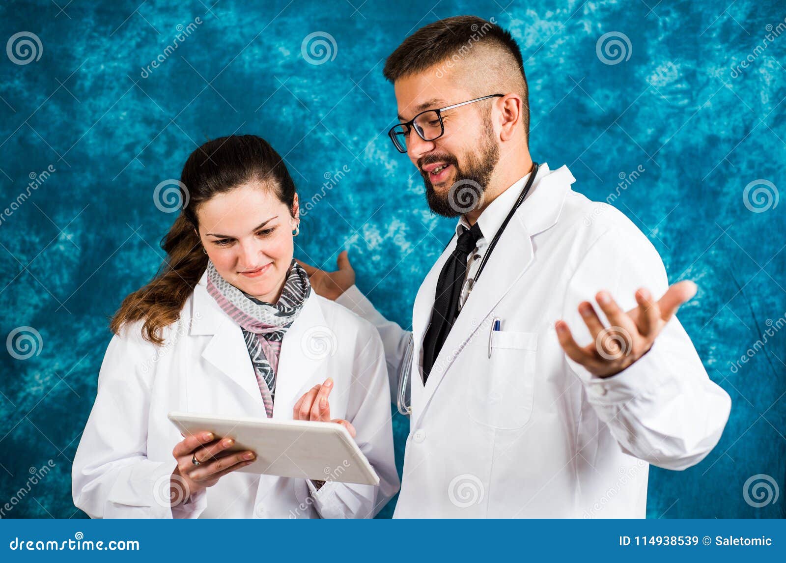 Doctors Looking at Electronic Tablet Device Stock Image - Image of ...