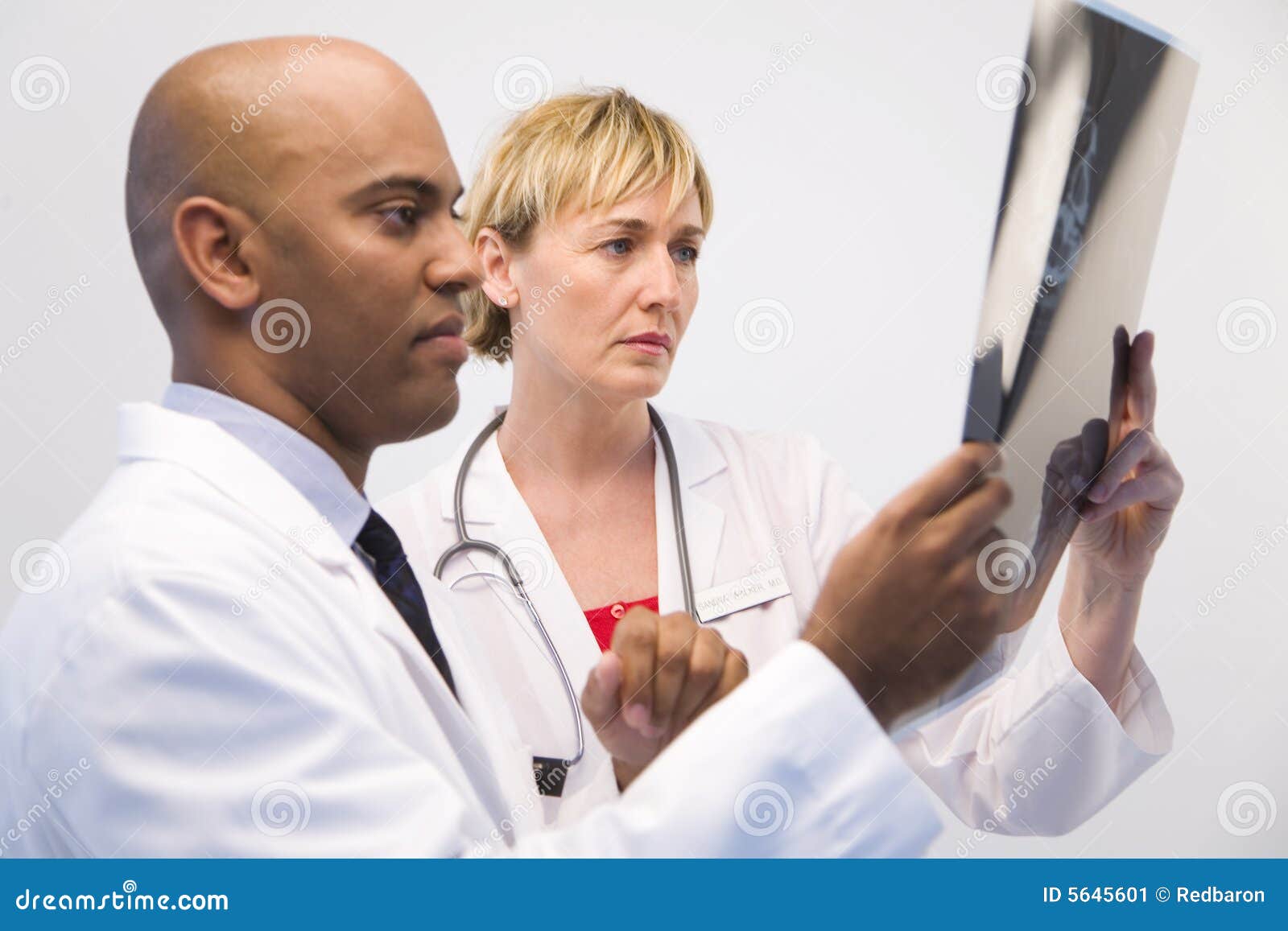 Doctors looking at X-ray stock image. Image of surgeons - 5645601