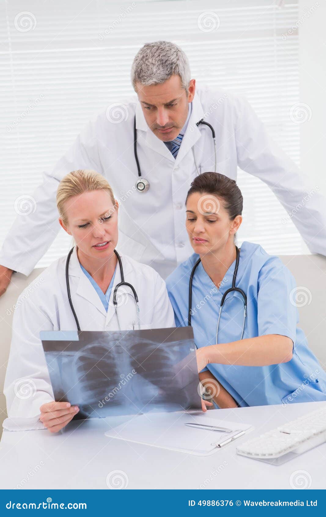 Doctors looking at scans stock photo. Image of caucasian - 49886376