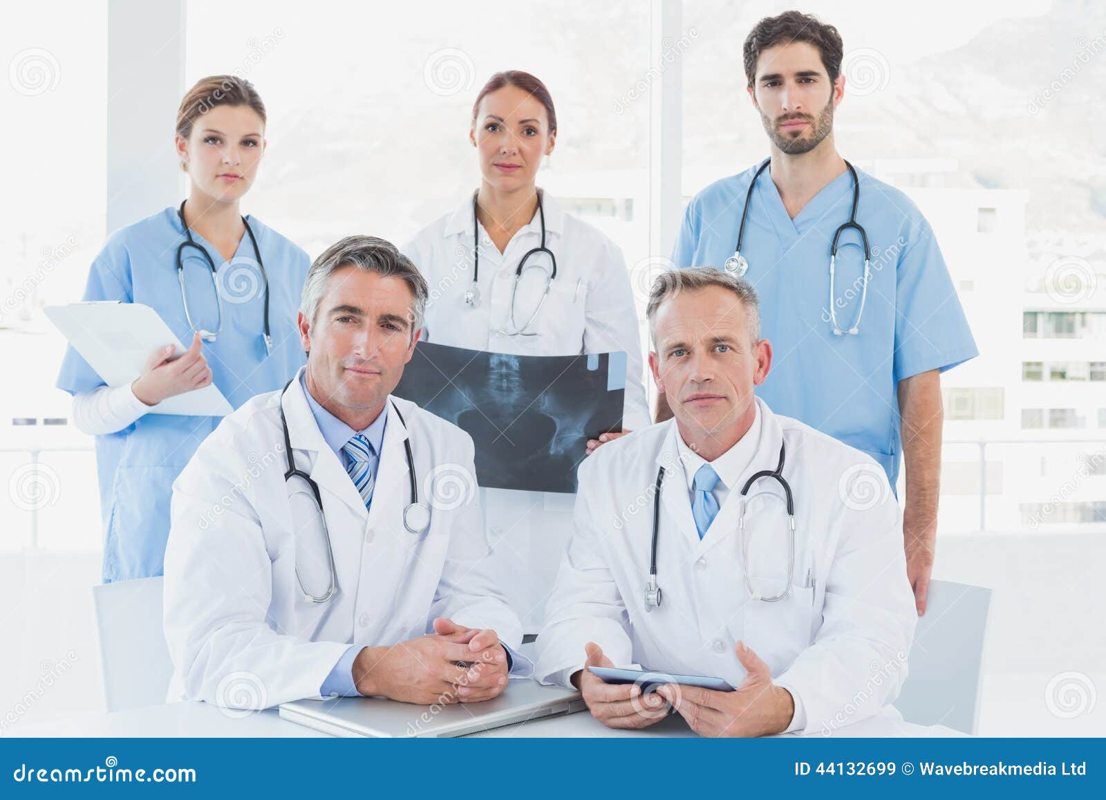 Doctors Looking Serious at Camera Stock Image - Image of five, young ...