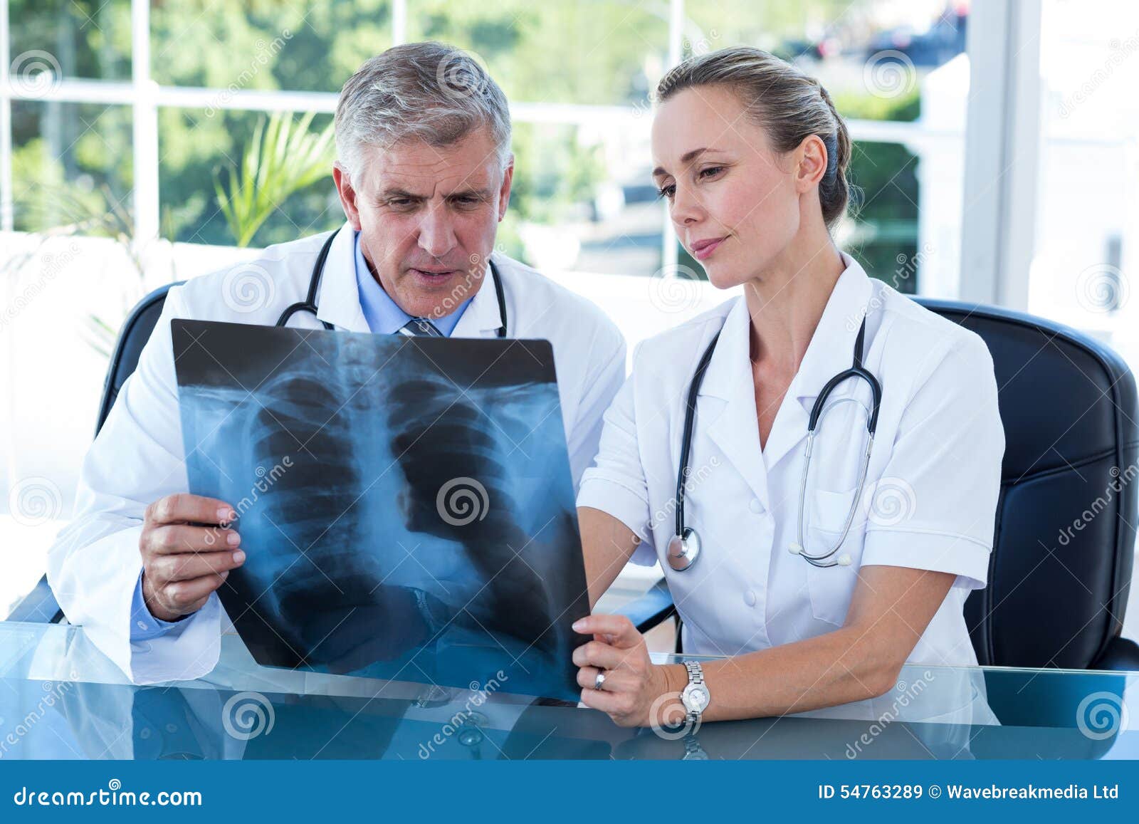 Doctors Looking Together at Xray Stock Image - Image of adult, mature ...