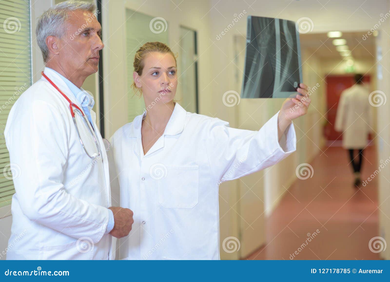 Doctors looking at xray stock image. Image of healthcare - 127178785