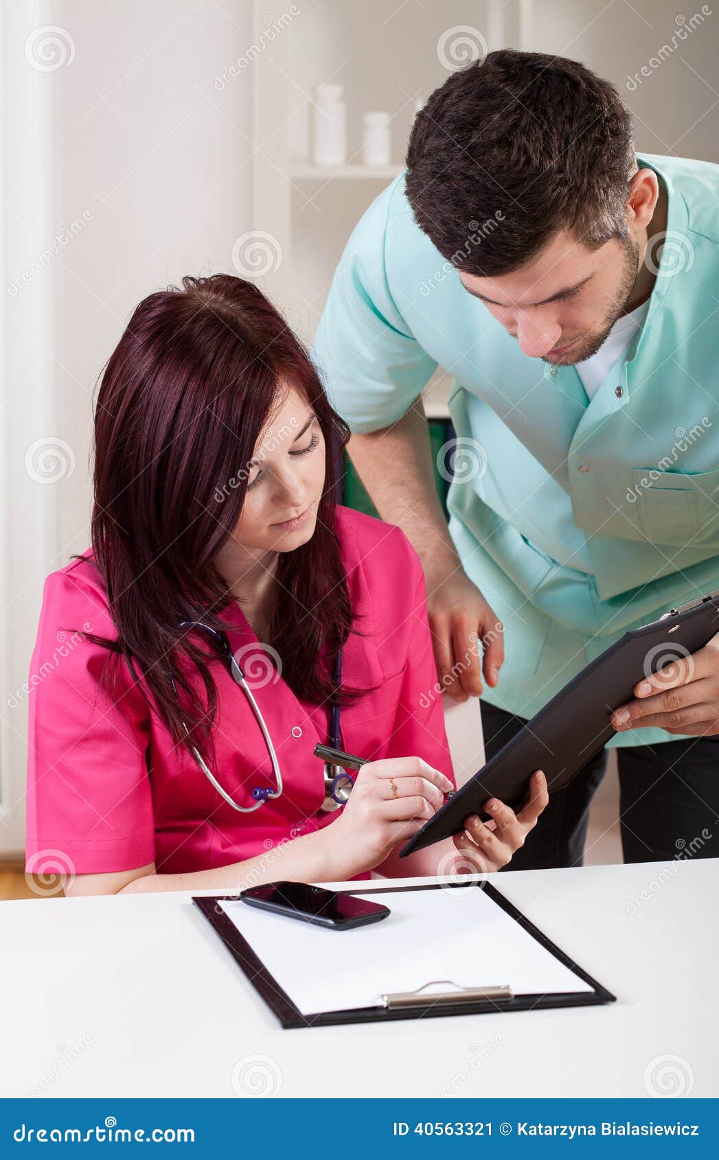 Doctors Making Medical Notes Stock Image - Image of apron, documents ...