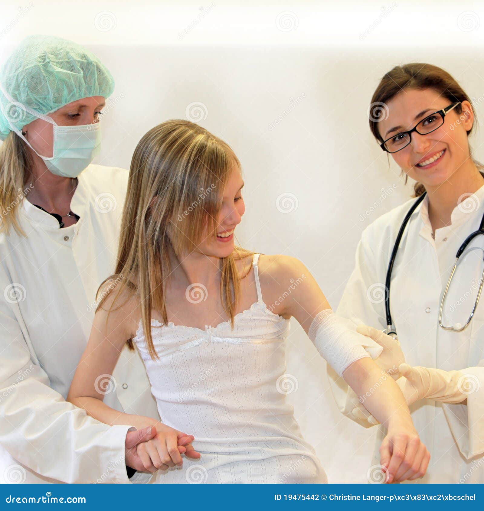 Doctors and Nurses Join the Injured Arm of a Child Stock Photo - Image ...