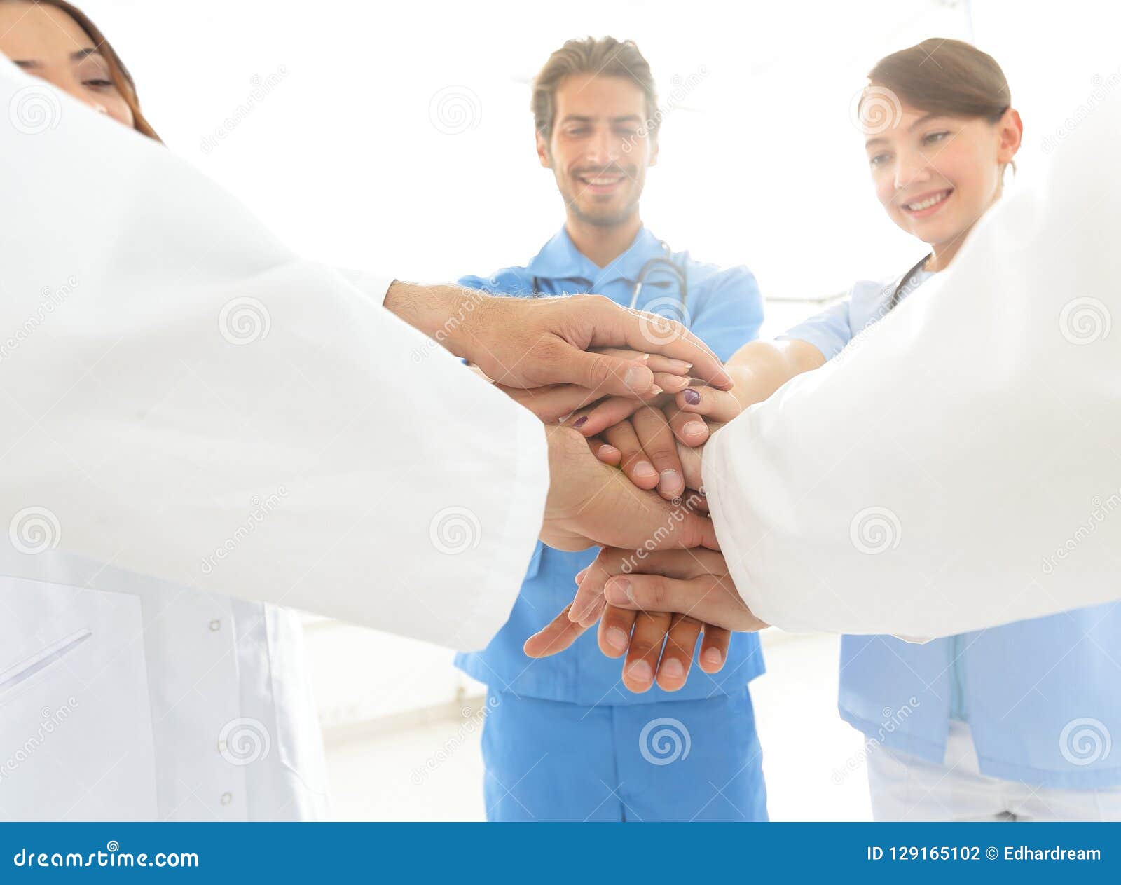 Doctors and Nurses in a Medical Team Stacking Hands Stock Photo - Image ...