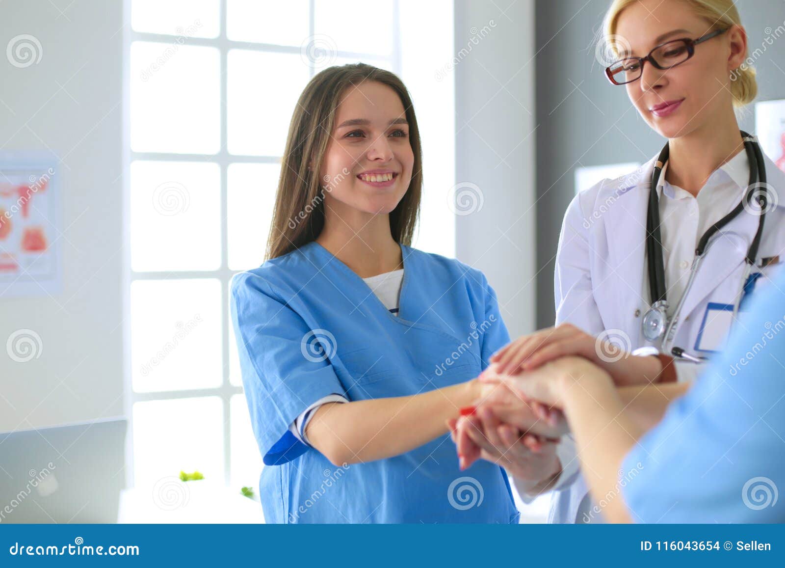 Doctors and Nurses in a Medical Team Stacking Hands Stock Photo - Image ...