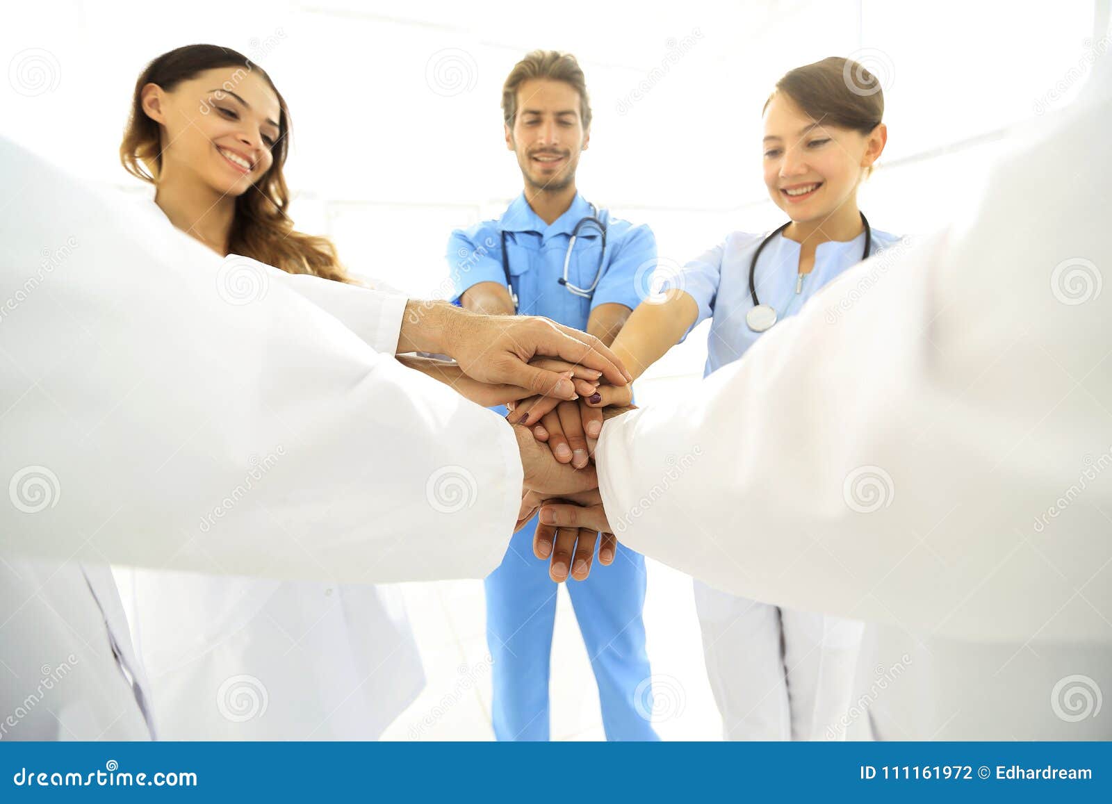 Doctors and Nurses in a Medical Team Stacking Hands Stock Photo - Image ...