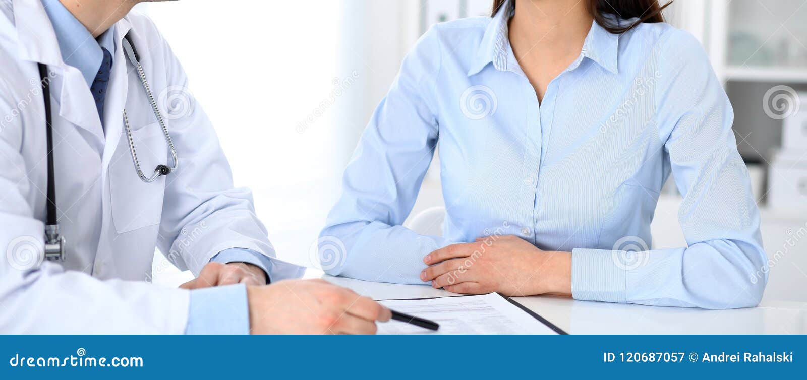 Doctors and Patient Talking while Sitting at the Table . Concept of ...