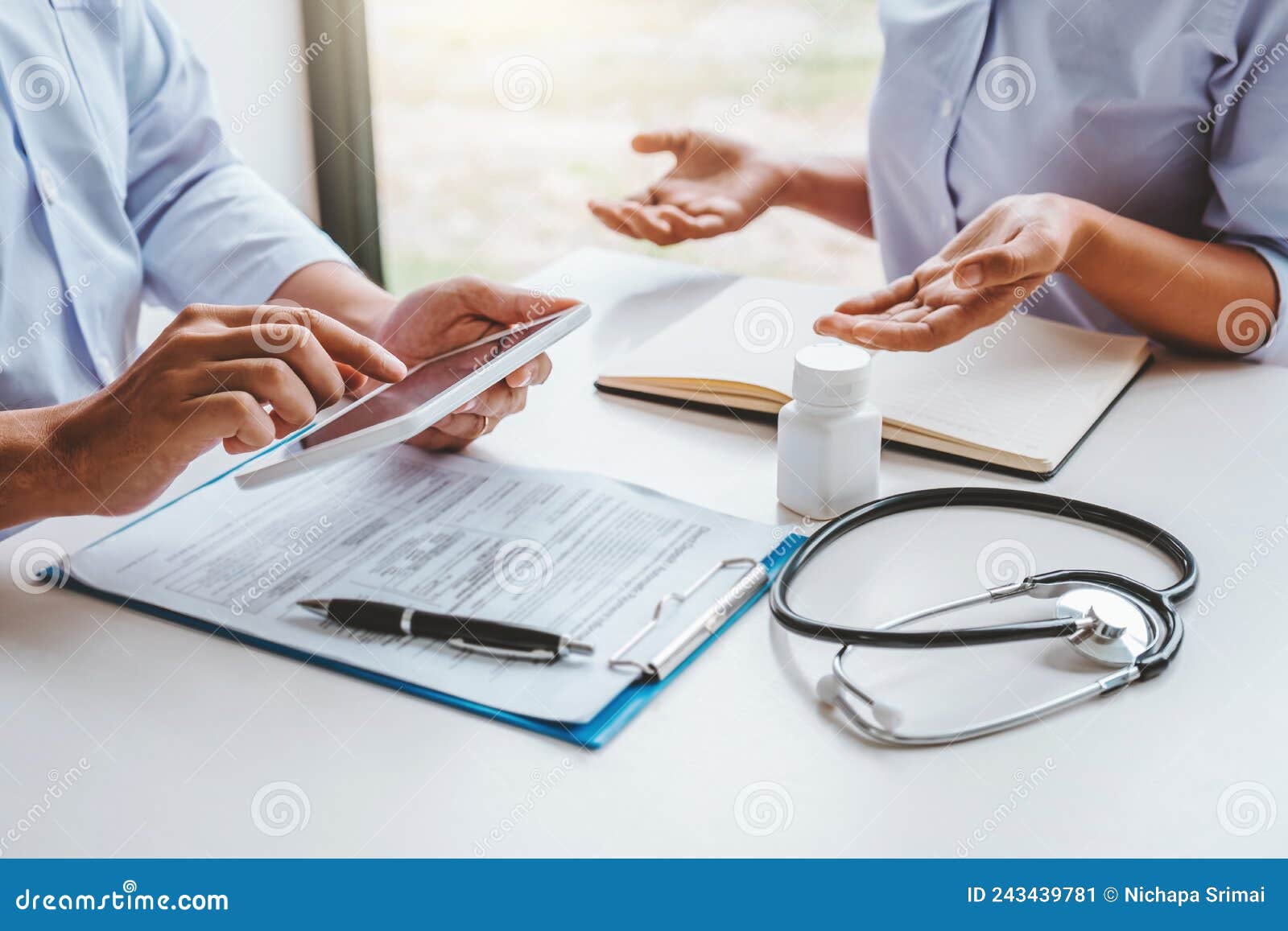 Doctors and Patients Consulting about Treatment Guidelines at Office ...