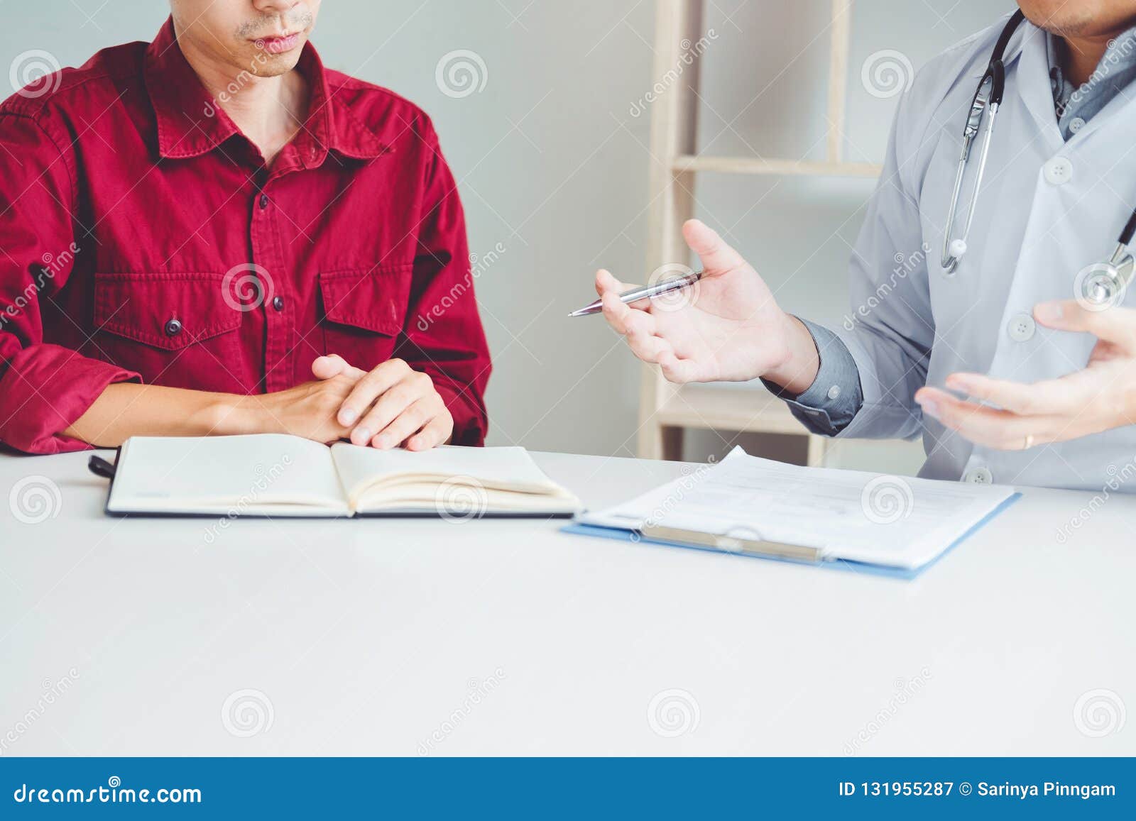 Doctors and Patients Sit and Talk. at the Table Near the Window Stock ...