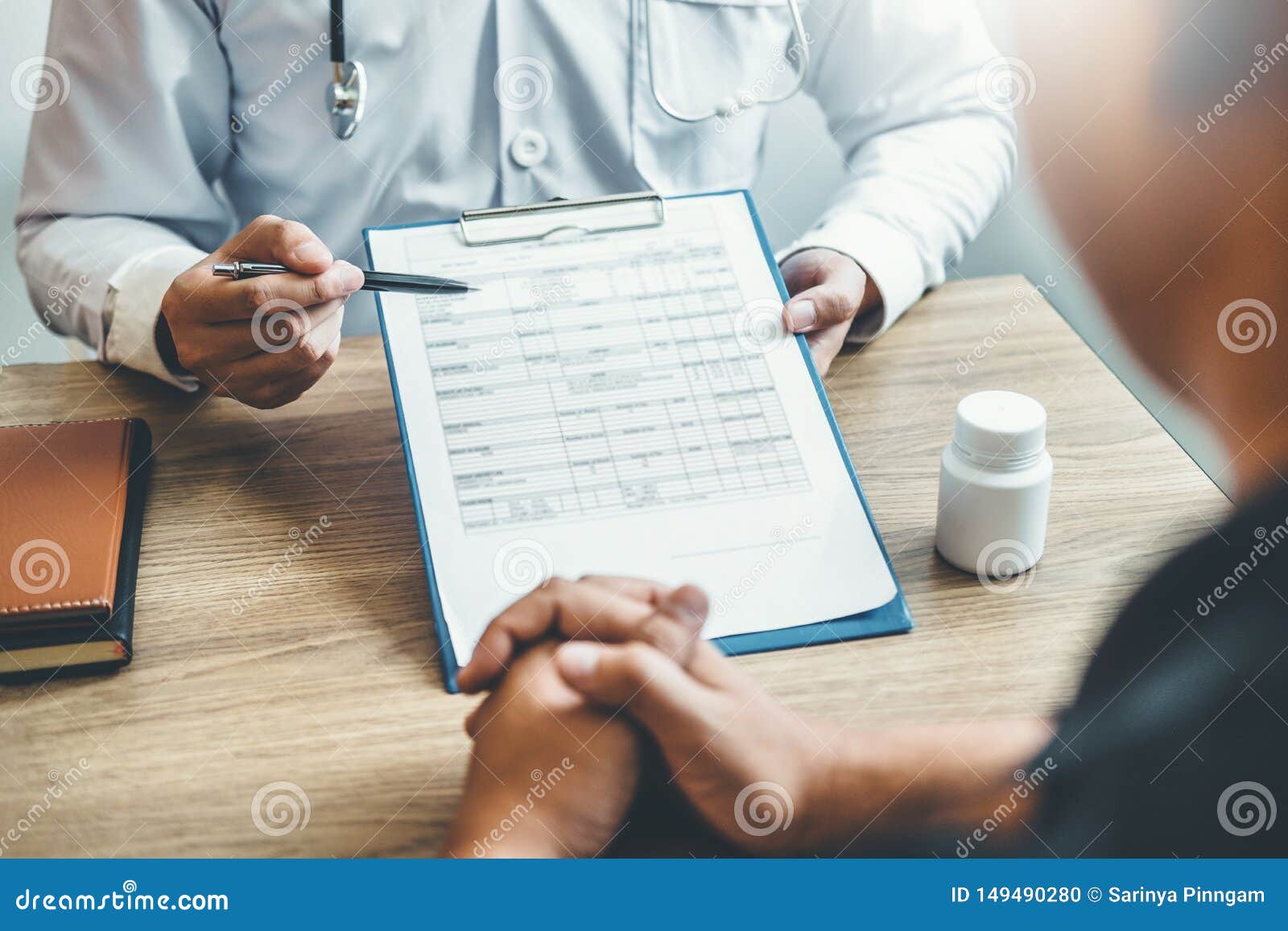 Doctors and Patients Sit and Talk. at the Table Near the Window in the ...