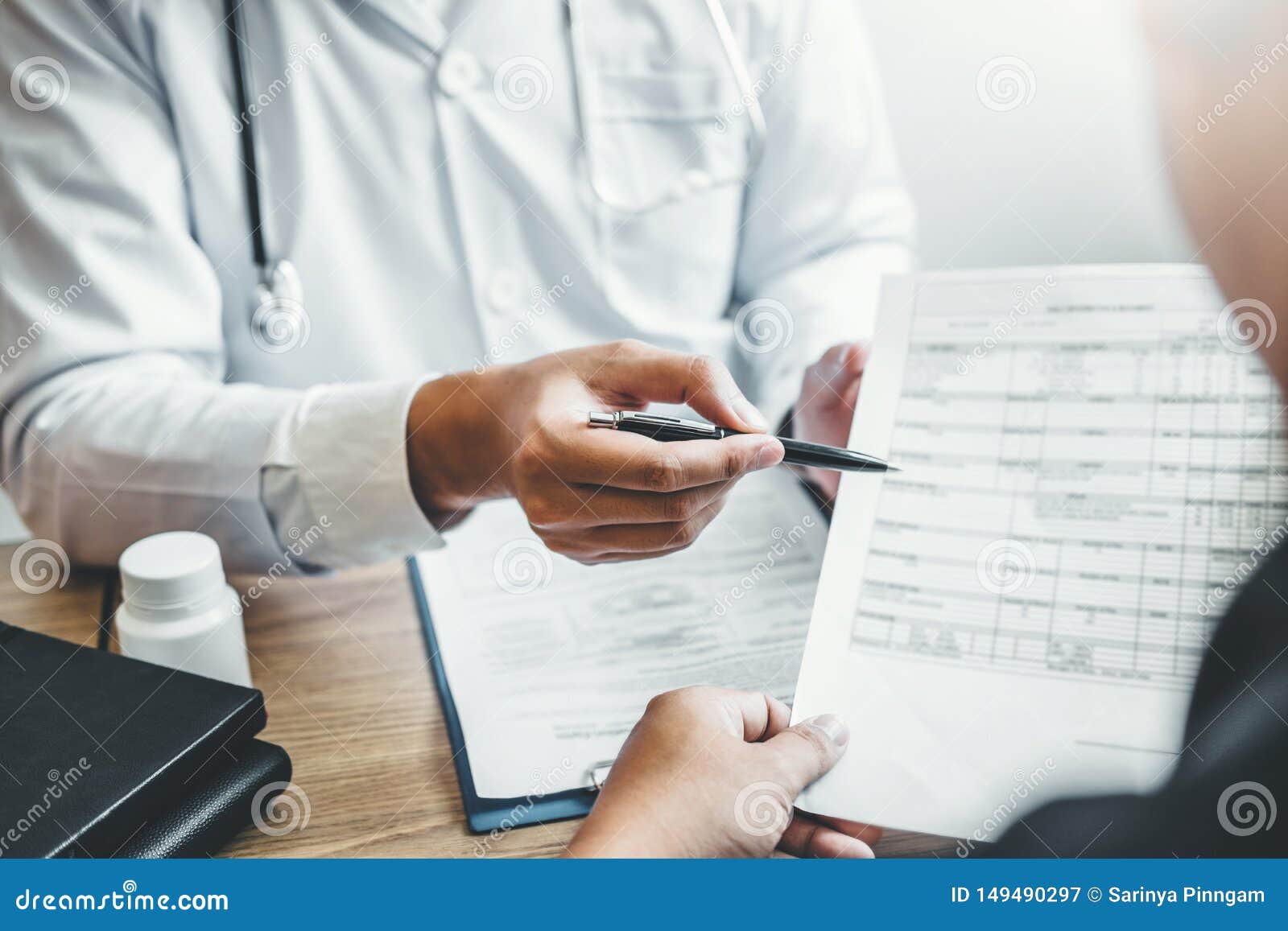 Doctors and Patients Sit and Talk. at the Table Near the Window in the ...
