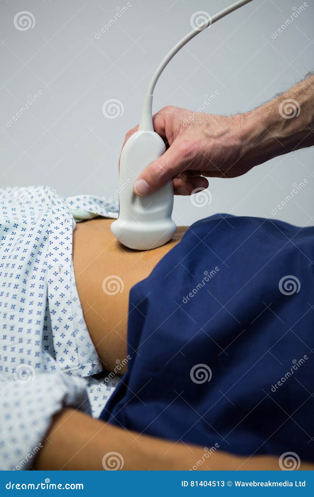 Doctors Performing a Doppler Sonography on Patient Stock Image - Image ...