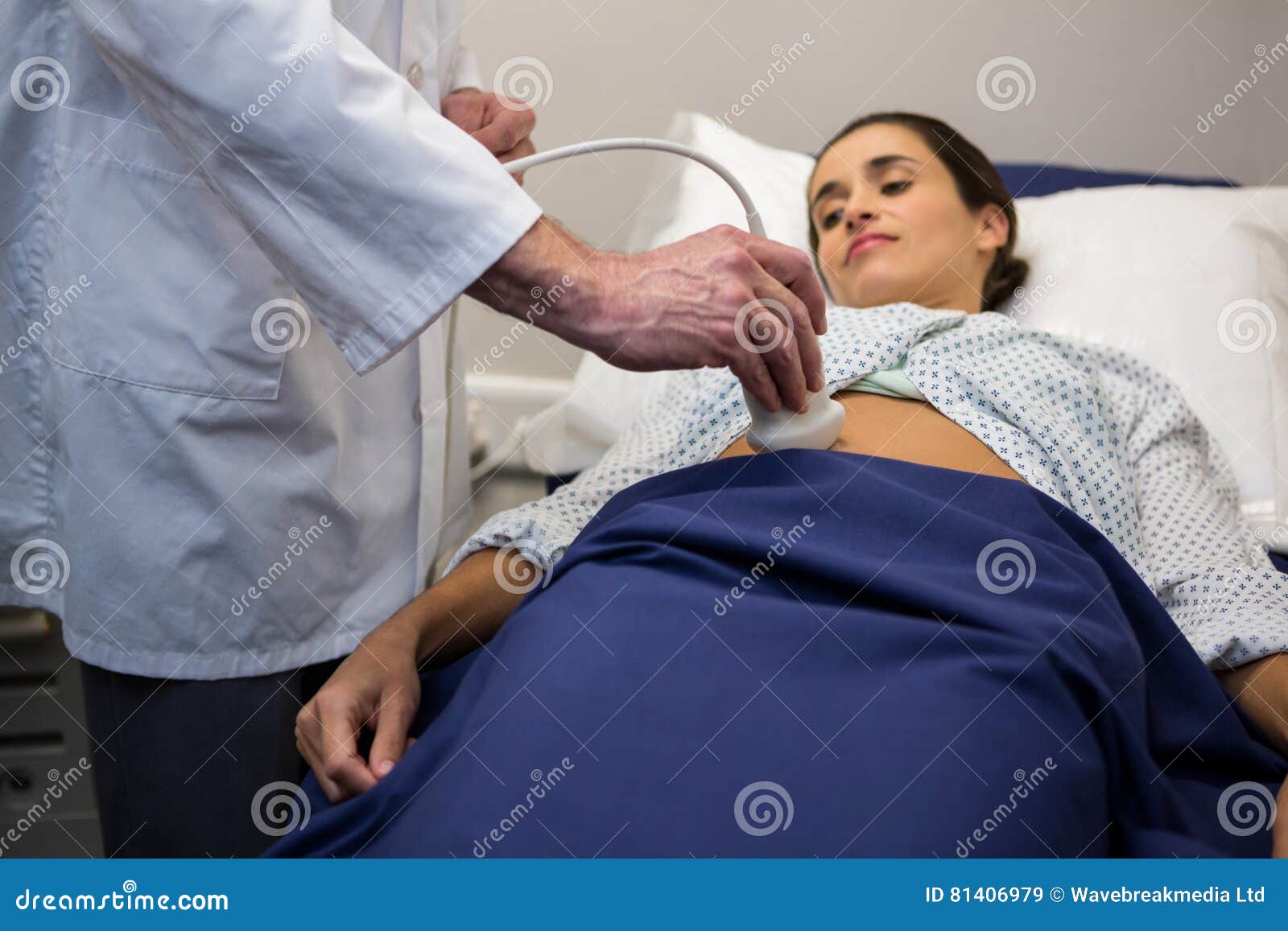 Doctors Performing a Doppler Sonography on Patient Stock Image - Image ...