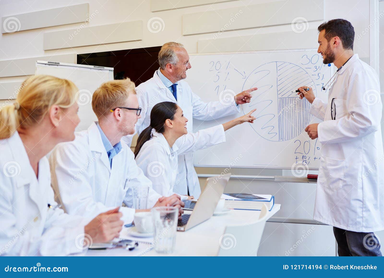 Doctors Presenting with Graph Stock Photo - Image of senior, team ...