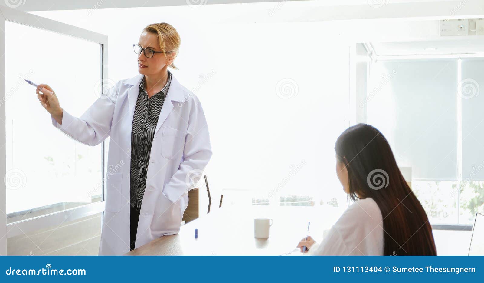 Doctors or Scientists are Teaching and Explaining Students and P Stock ...