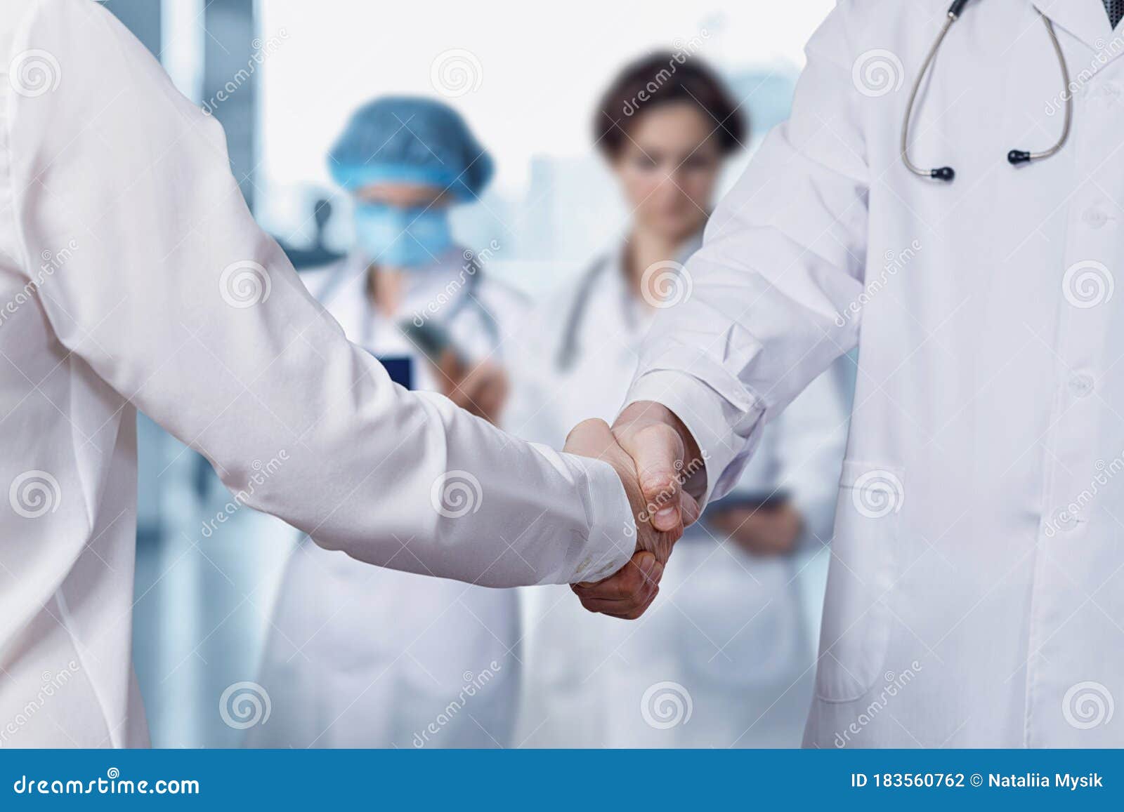 Two Doctors Shake Their Hands. Medical Handshake Royalty-Free Stock ...