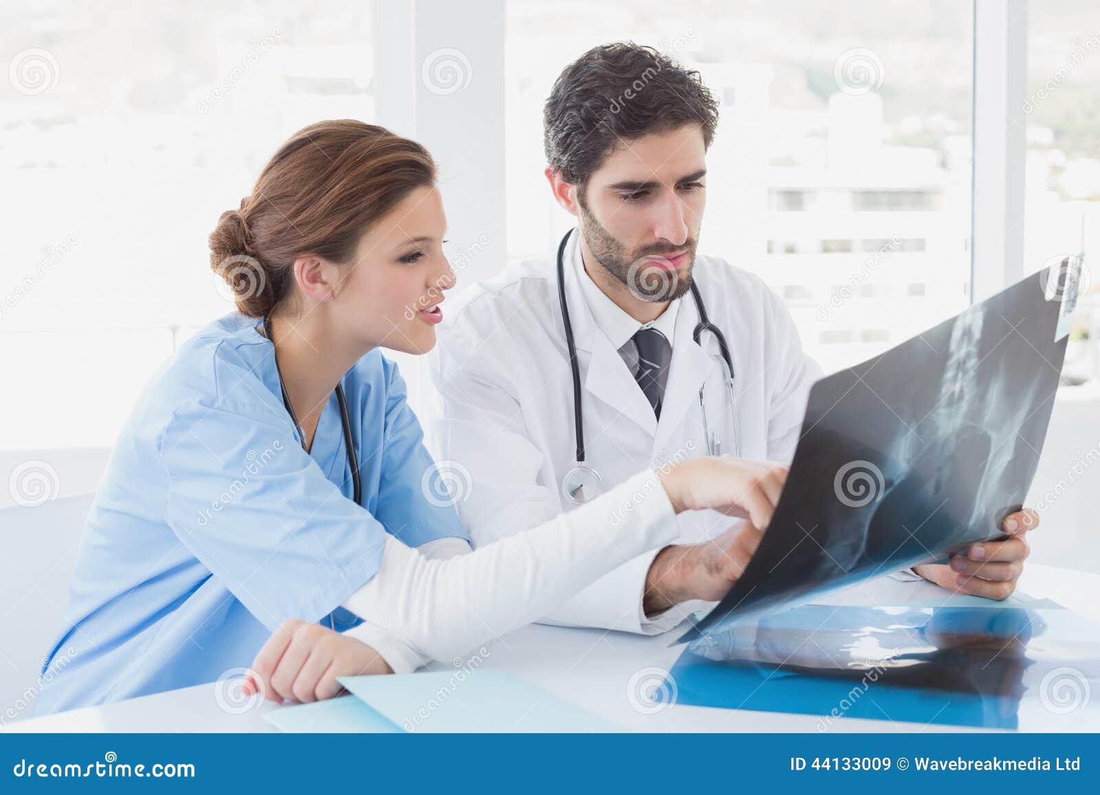 Doctors Sitting Together with X-rays Stock Image - Image of health ...
