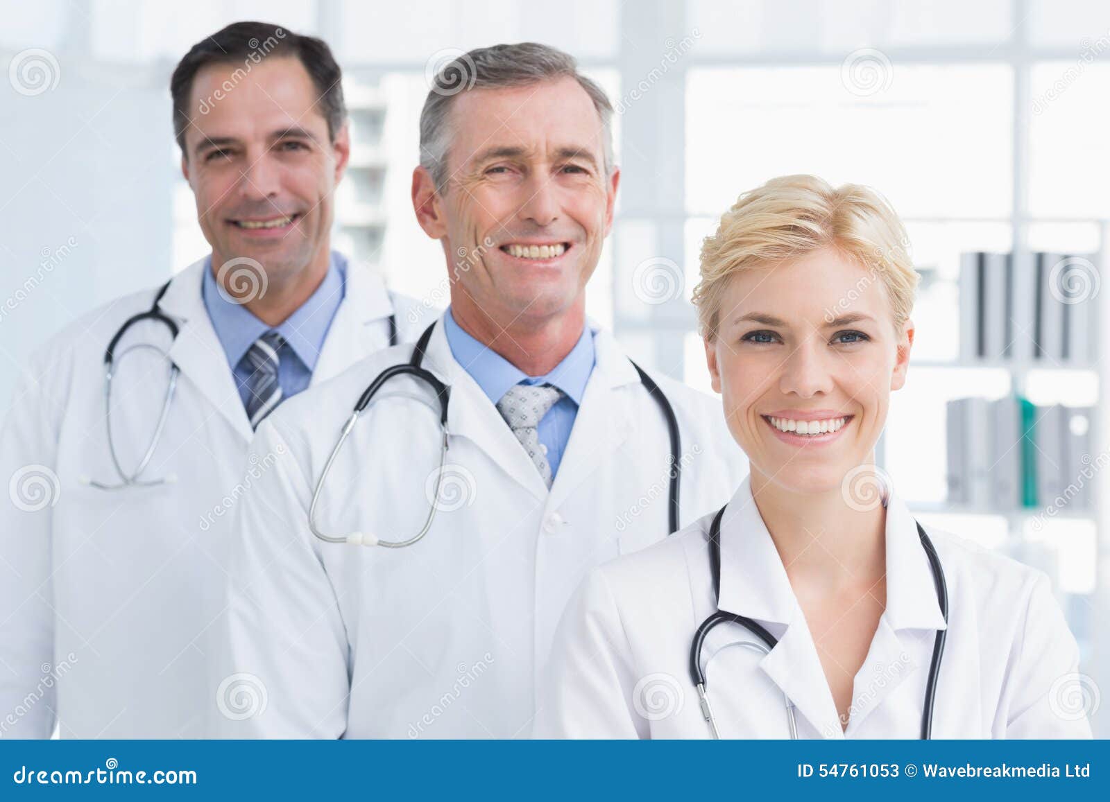 Doctors smiling at camera stock image. Image of people - 54761053