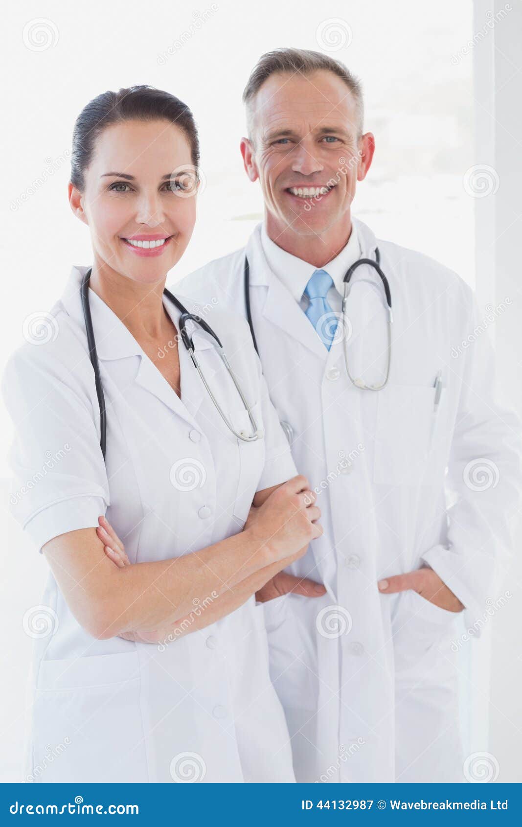 Doctors Smiling and Working Together Stock Image - Image of specialist ...