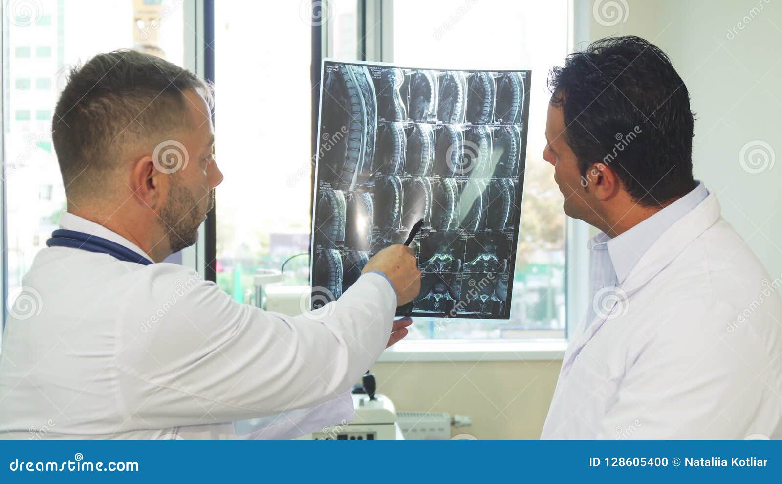 Experienced Doctors are Studying the X-Ray of Their Patient Stock Photo ...