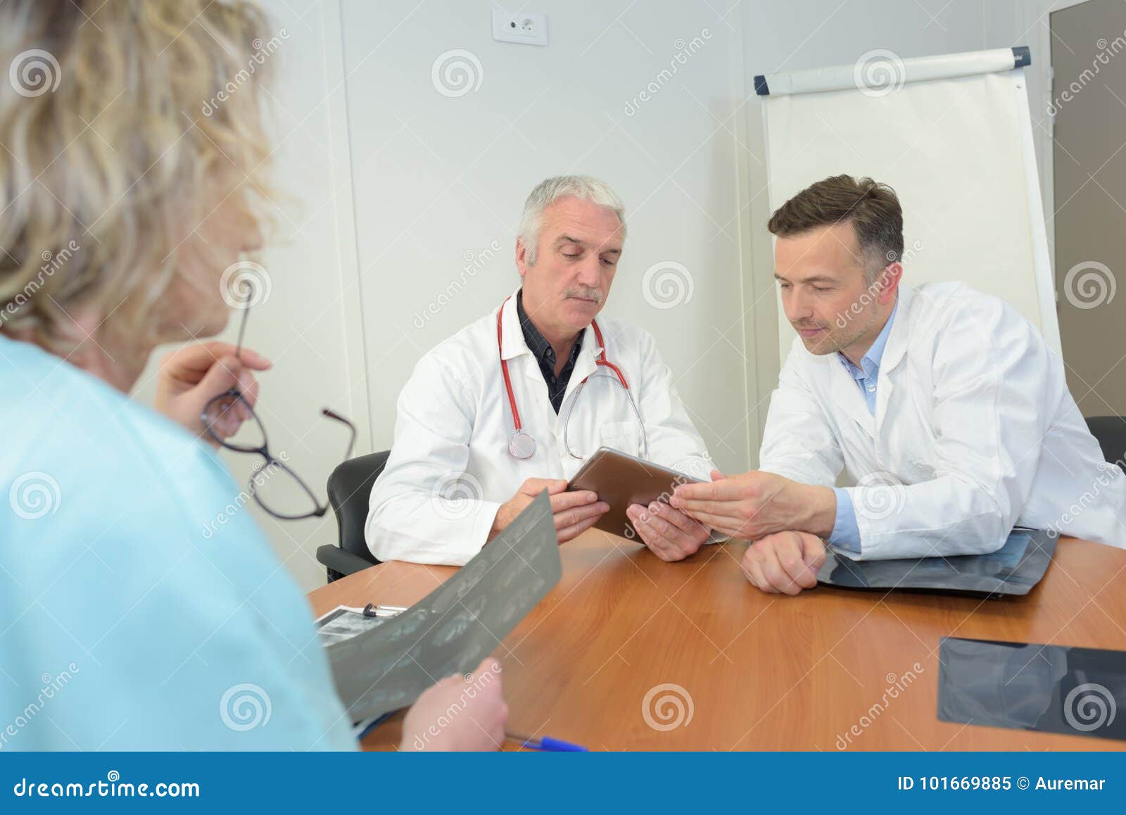 Doctors Studying Patients Case Stock Image - Image of teamwork ...