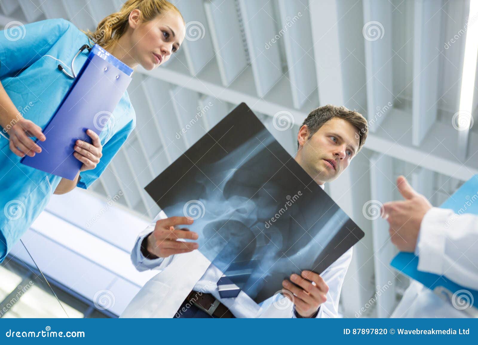 Doctors and Surgeon Discussing X-ray Stock Photo - Image of doctor ...
