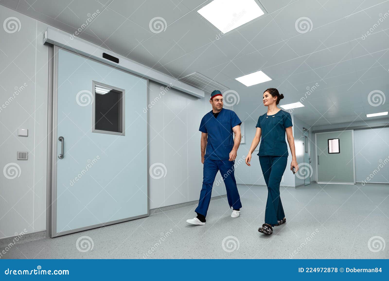 Doctors Surgeons Walk Along the Corridor of the Clinic in Suspense ...