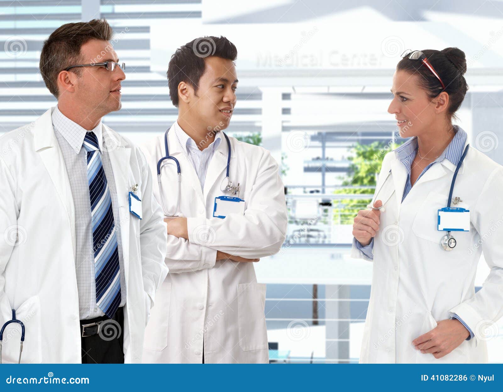 Doctors Talking in Clinics Hallway Stock Photo - Image of clinician ...