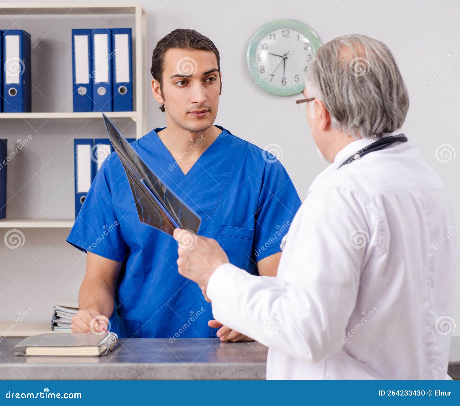Two Doctors Talking at the Reception in Hospital Stock Photo - Image of ...
