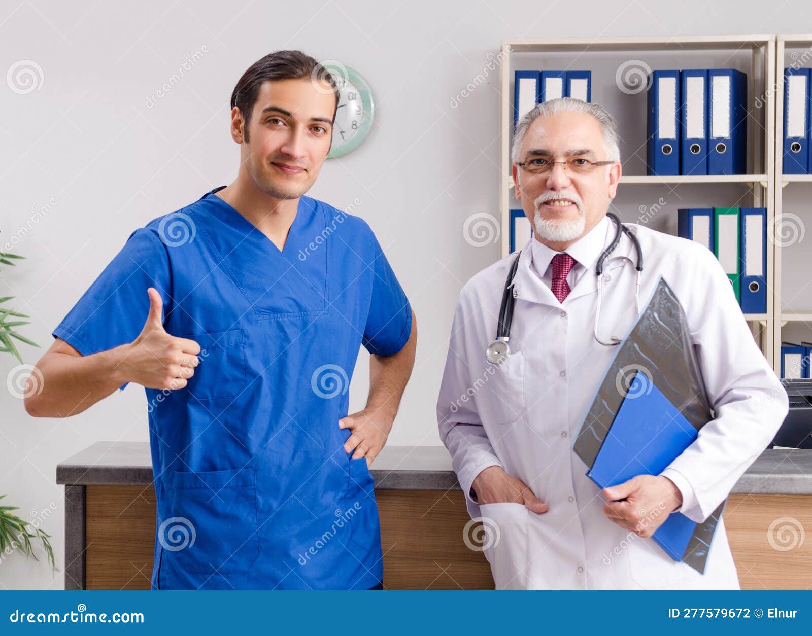 Two Doctors Talking at the Reception in Hospital Stock Photo - Image of ...