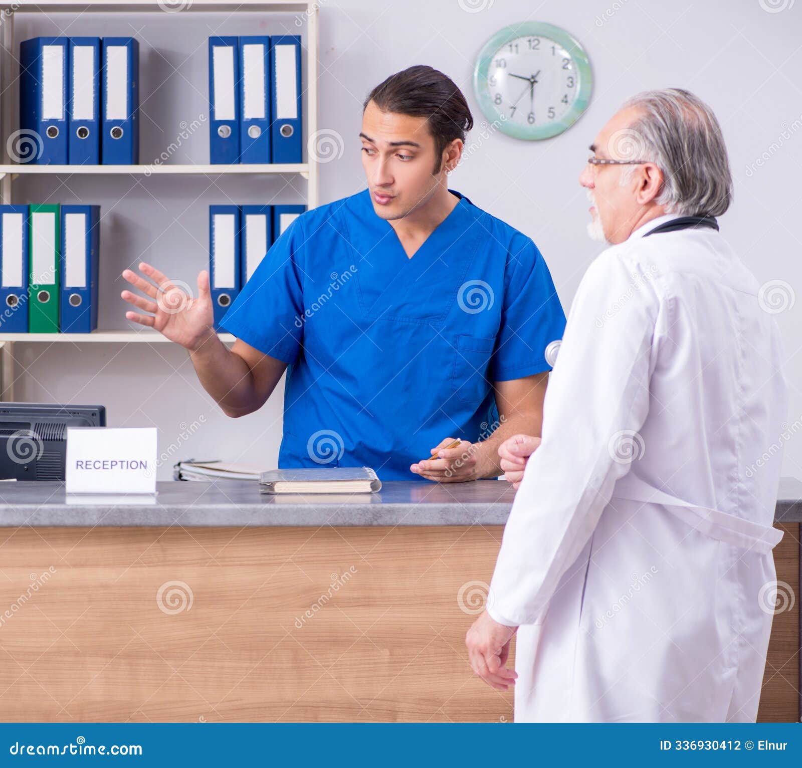 Two Doctors Talking at the Reception in Hospital Stock Photo - Image of ...