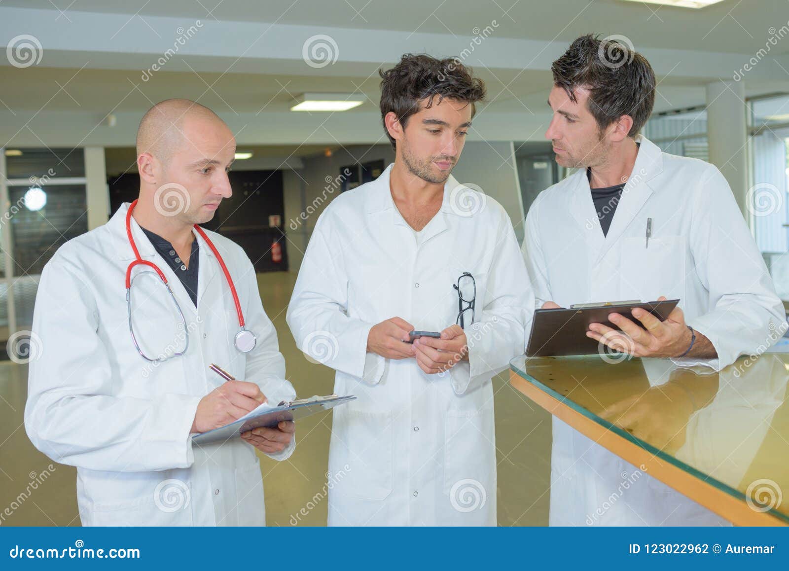 Doctors Talking about Their Schedules Stock Photo - Image of consulting ...