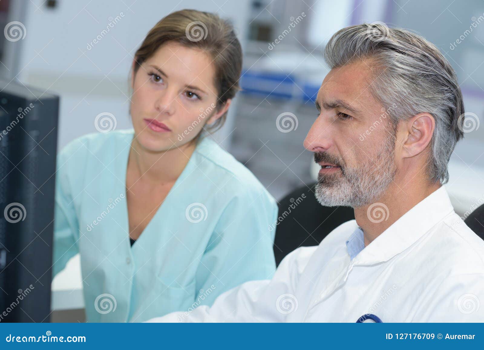 Doctors using a computer stock image. Image of doctors - 127176709