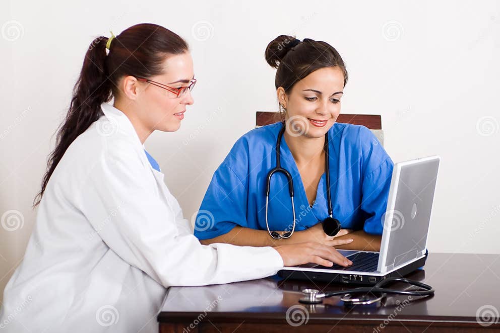 Doctors using computer stock image. Image of colleagues - 8095809