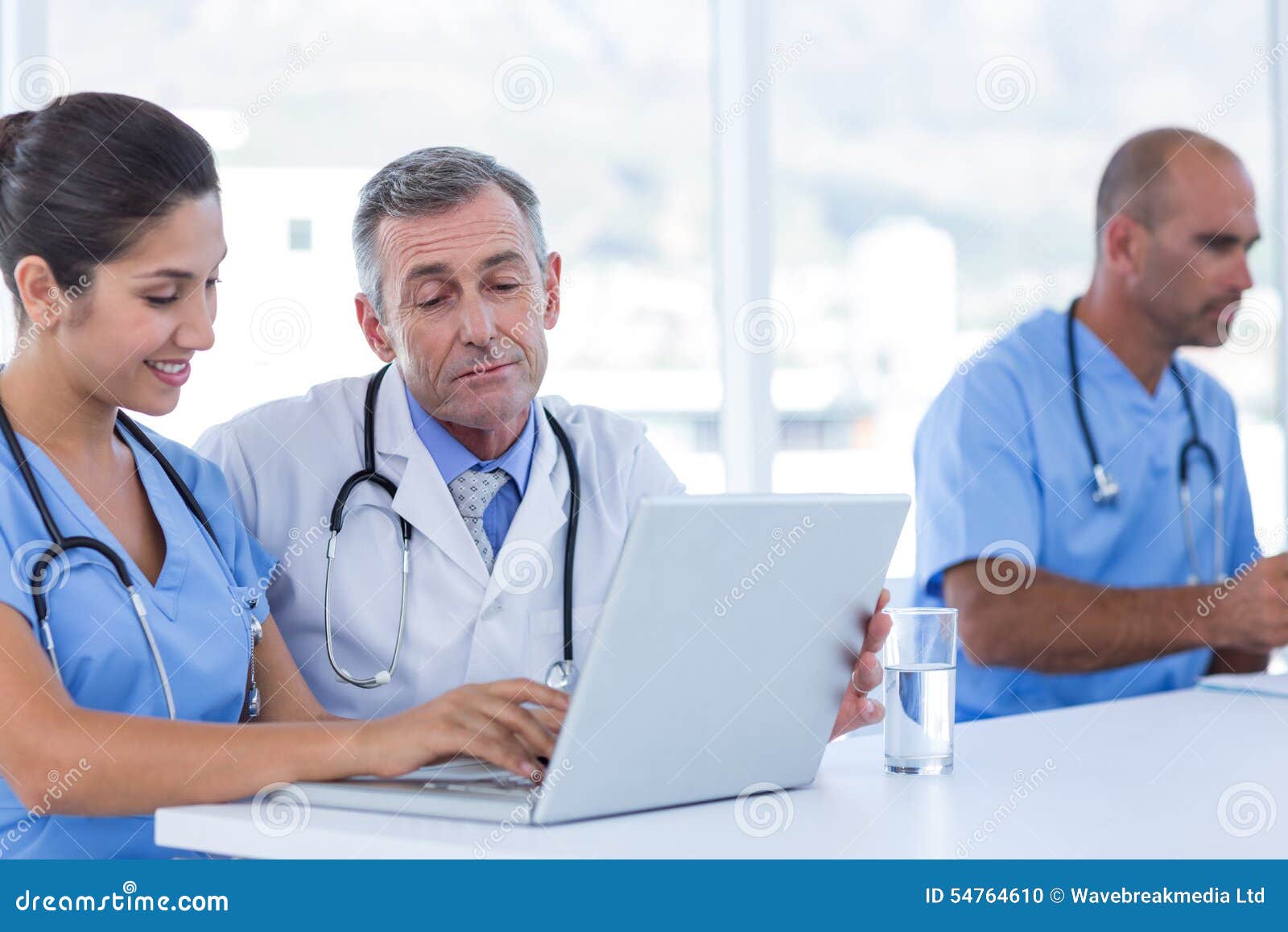 Doctors using computer stock photo. Image of expertise - 54764610