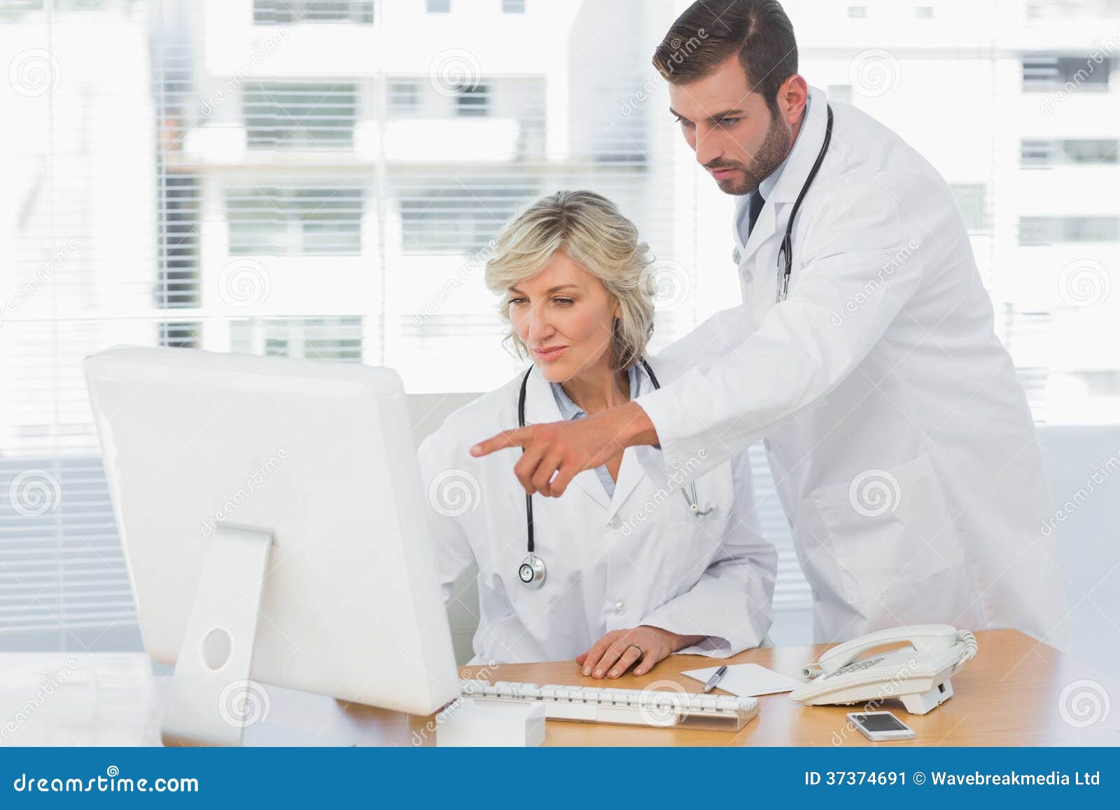 Doctors Using Computer at Medical Office Stock Image - Image of adult ...