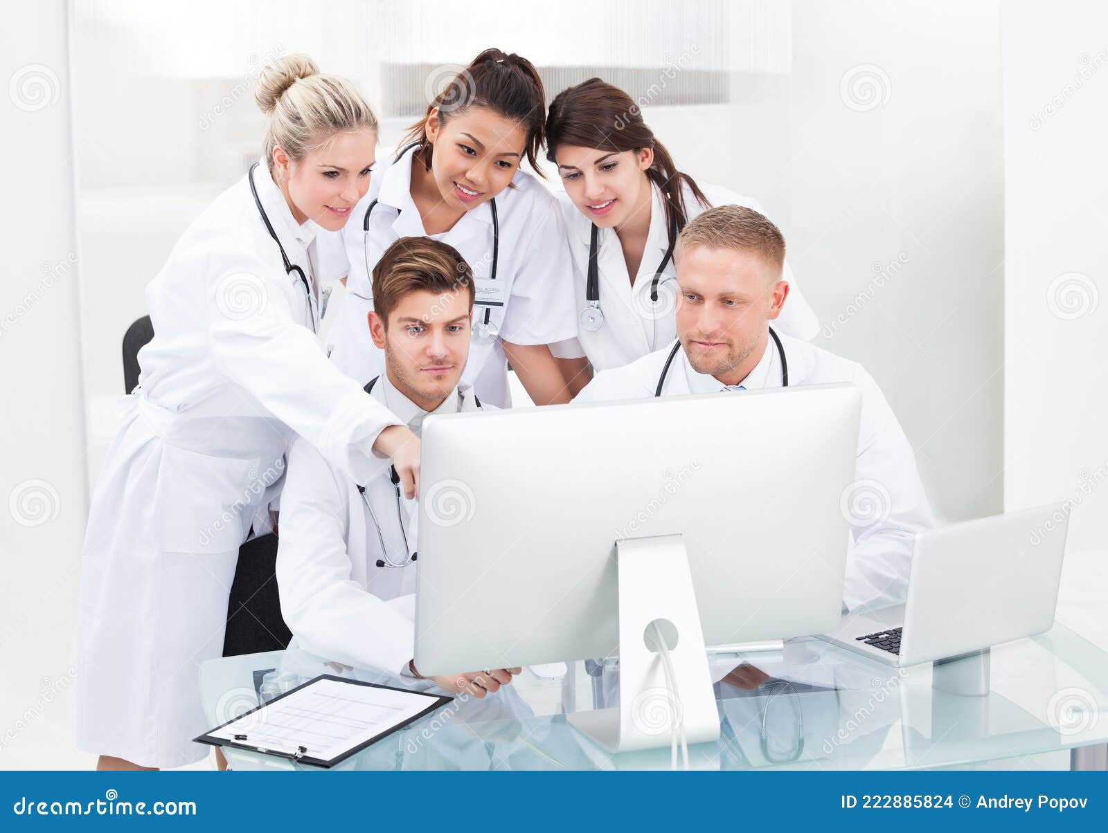 Doctors Using Desktop PC stock photo. Image of diverse - 222885824