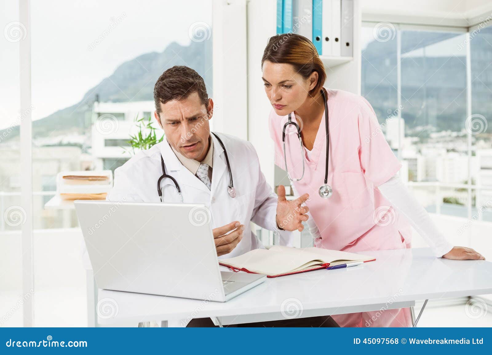 Doctors Using Laptop at Medical Office Stock Photo - Image of stethos ...