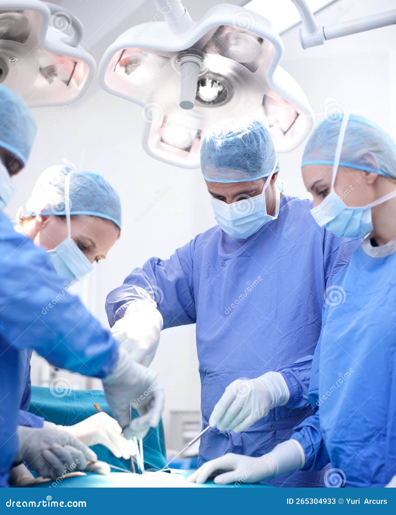 Doctors at Work. Diverse Group of Surgeons Working Together Wearing ...