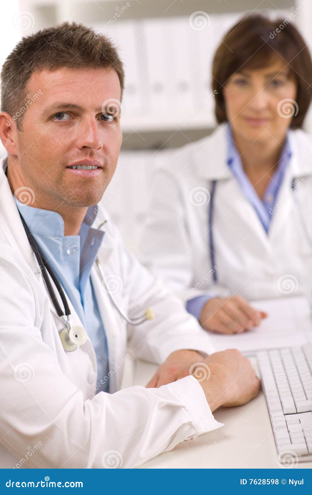Doctors working at office stock photo. Image of friendly - 7628598