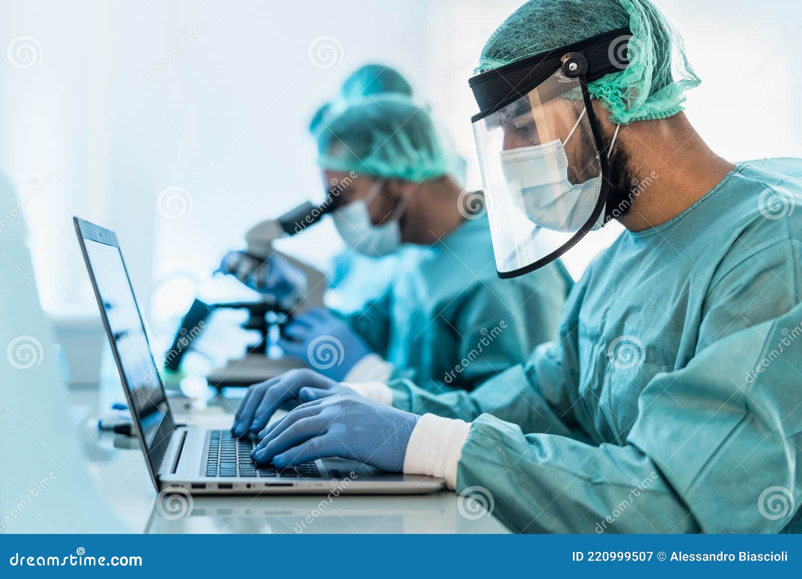 Doctors Working in Research Laboratory Using Computer and Examining ...