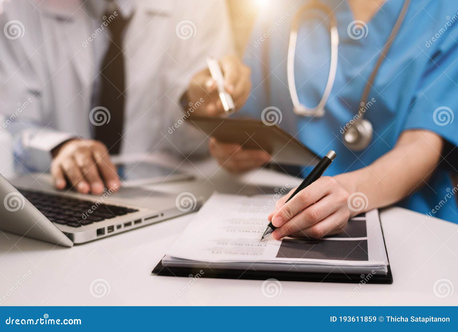 Doctors Working Together on Digital Tablet Healthcare Doctor Technology ...
