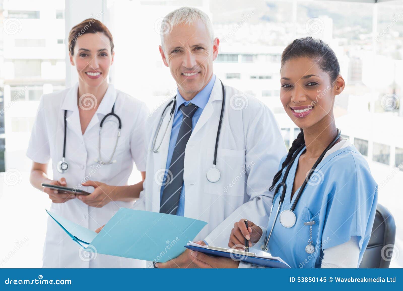 Doctors Working Together on Patients File Stock Image - Image of health ...