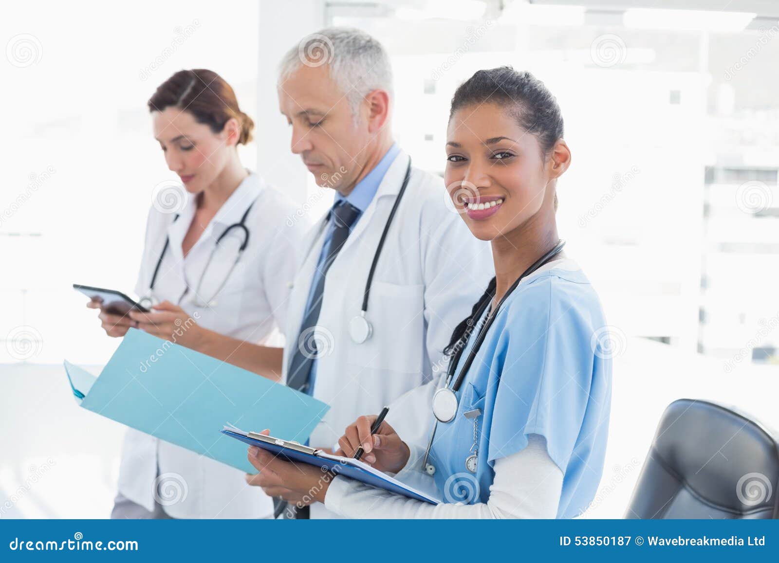 Doctors Working Together on Patients File Stock Image - Image of ...