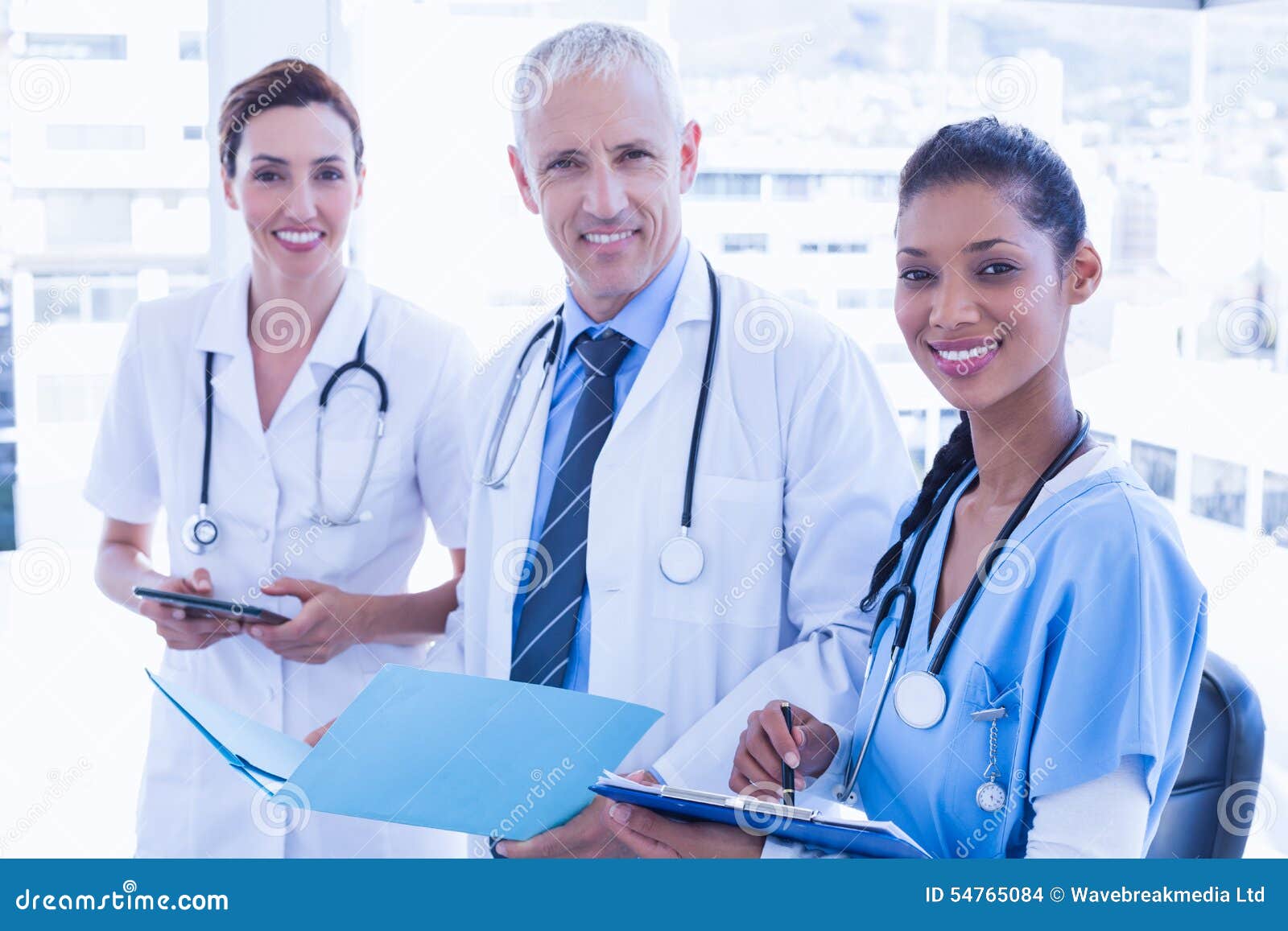 Doctors Working Together on Patients File Stock Photo - Image of ...