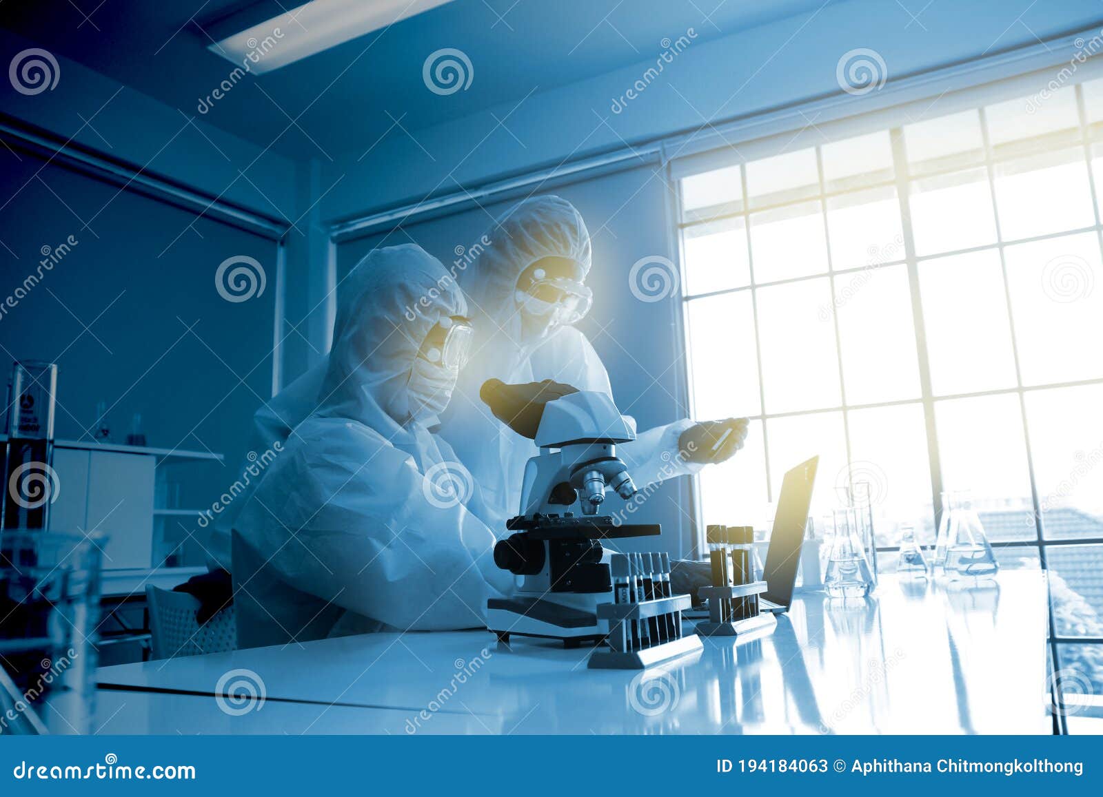 Doctors Working in Virus Lab. Doctor Using Microscope Check for Viruses ...