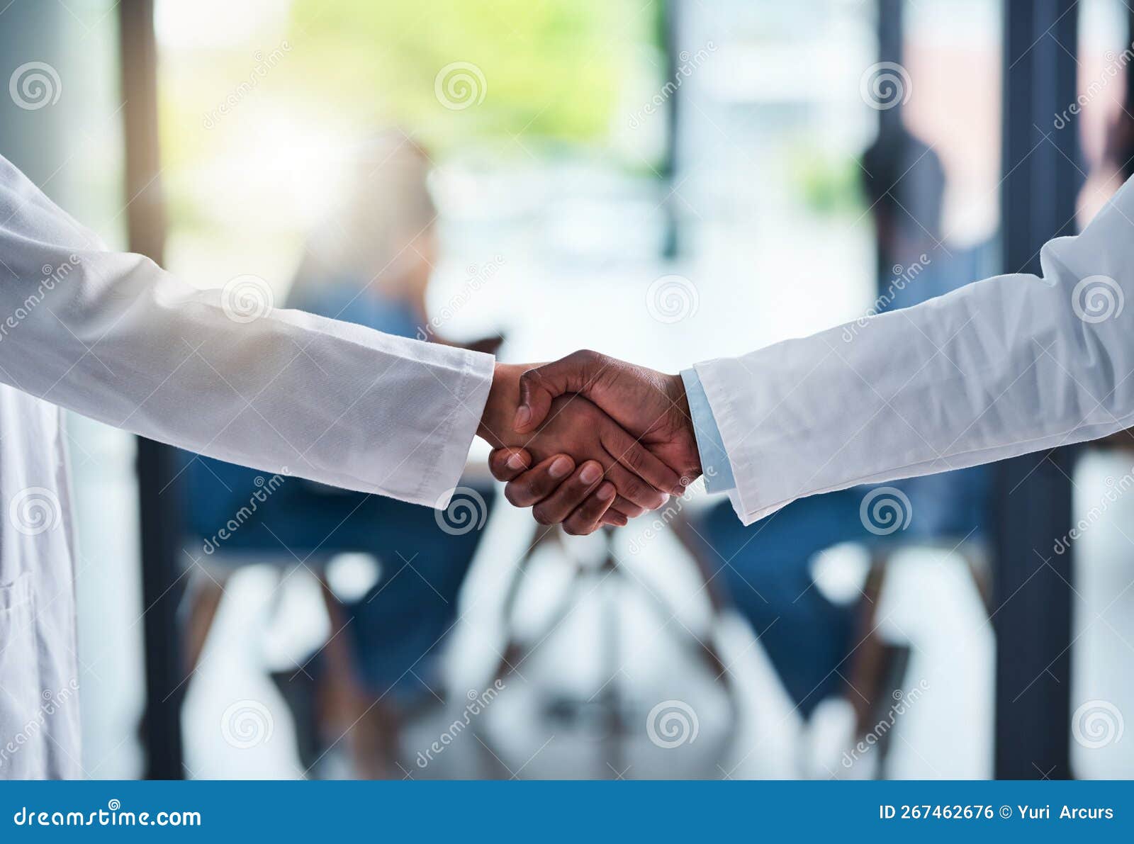 Doctors You Can Trust. Two Unrecognizable Doctors Shaking Hands Inside ...