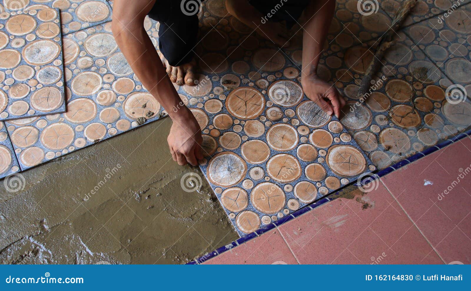 Construction Workers when Installing Ceramic Tiles for Floors Stock ...